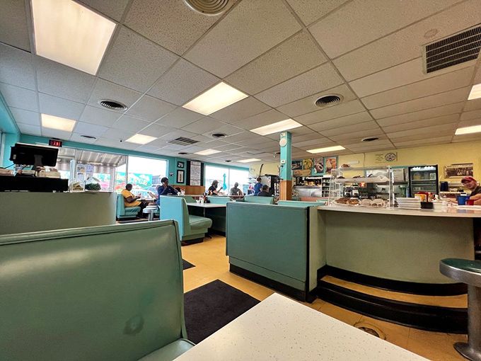 Those aqua blue booths have cradled more Omaha stories than a library. Classic diner seating that's seen decades of Saturday morning regulars.