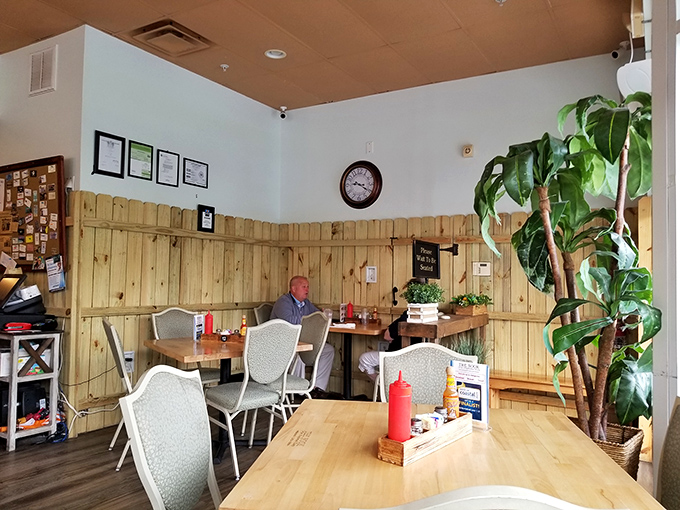 Wooden wainscoting and potted plants create that "grandma's kitchen" vibe&mdash;if grandma happened to be a breakfast wizard with serious cooking chops.