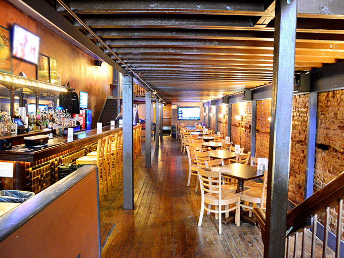 Step inside and the warm wooden interior whispers promises of maritime delights, with exposed brick walls that have witnessed countless oyster revelations.