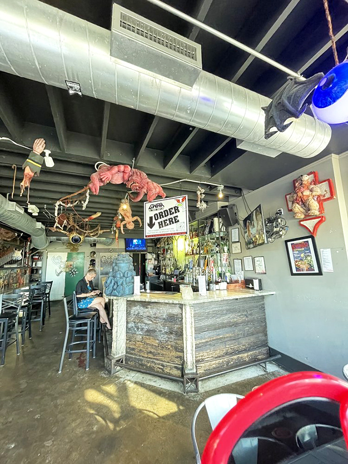 The ceiling decor at GWARbar answers the age-old question: "What if H.R. Giger designed a TGI Friday's?"