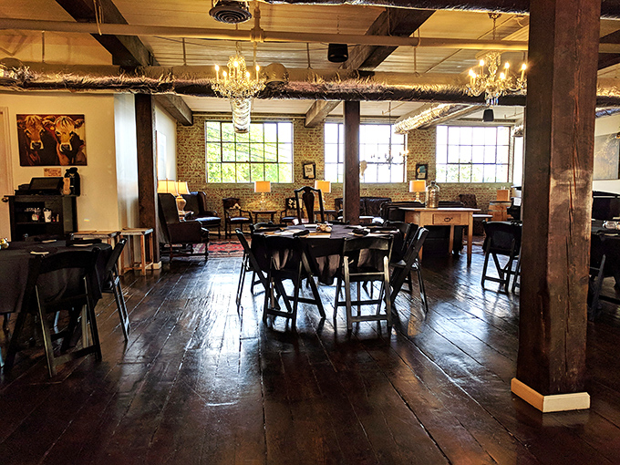 Rustic wooden beams meet elegant chandeliers in this dining room that whispers, "Yes, we're serious about steak" without saying a word.
