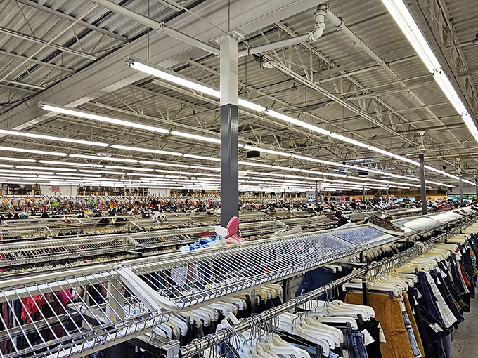Endless racks stretch toward retail infinity. This isn't just a clothing section&mdash;it's a textile galaxy where fashion from every decade awaits rediscovery.