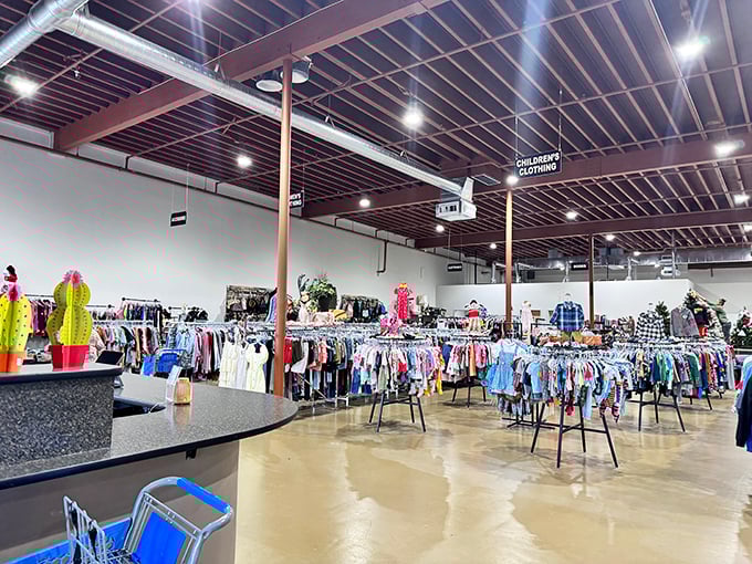 Beneath industrial ceilings that could host a small aircraft, racks of children's clothing stretch toward the horizon like a technicolor road map to bargain paradise.
