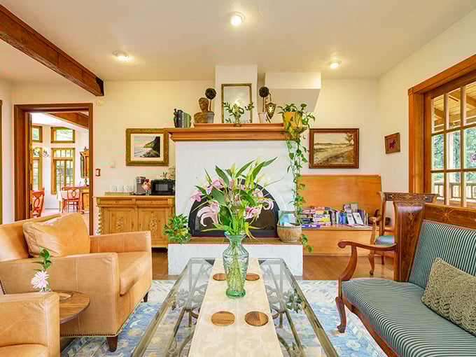 The elegant bathroom features a soaking tub where swan towel origami and rose petals transform an ordinary bath into a royal experience.
