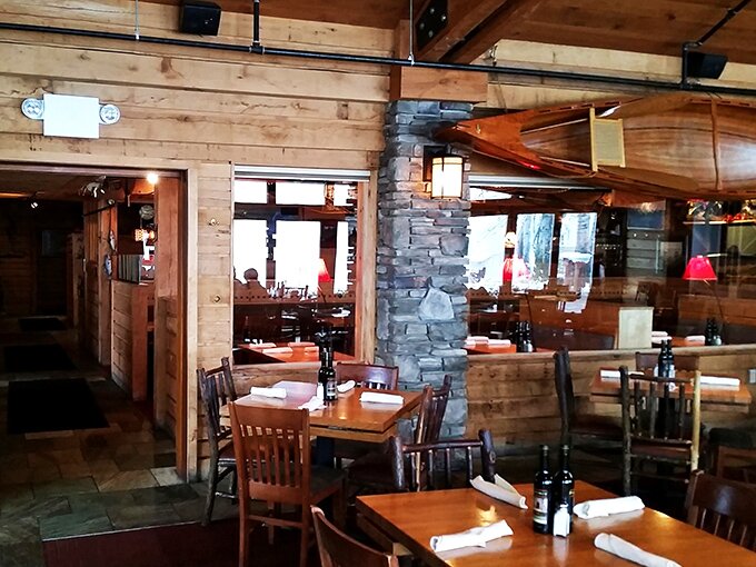 Rustic wooden beams and stone pillars create that perfect "Up North" atmosphere where comfort meets culinary excellence.