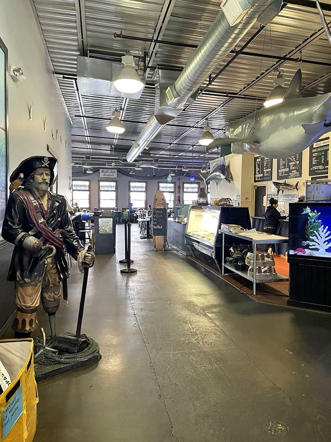 Inside, nautical kitsch meets serious seafood business. That pirate isn't guarding treasure – he's making sure you order enough fried clams.