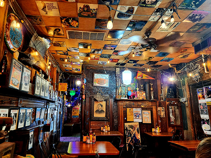 Album covers tile the ceiling like a rock 'n' roll quilt above wooden tables where countless Cajun feasts have unfolded since the 1970s.