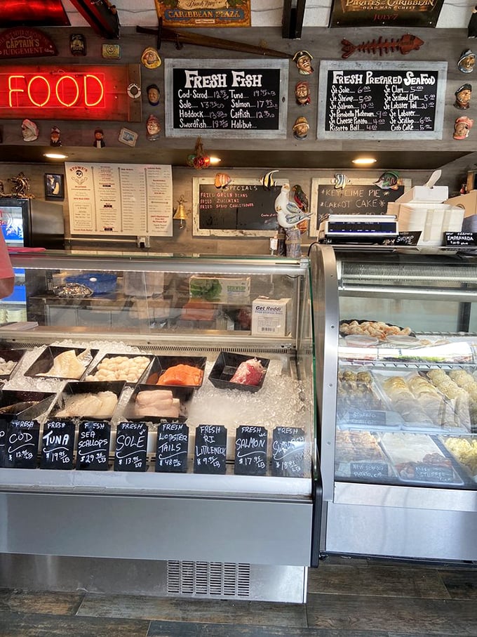 The neon "FOOD" sign isn't lying&mdash;this seafood counter is where dreams of fresh fish come true, with sailor figurines standing watch over the day's catch.