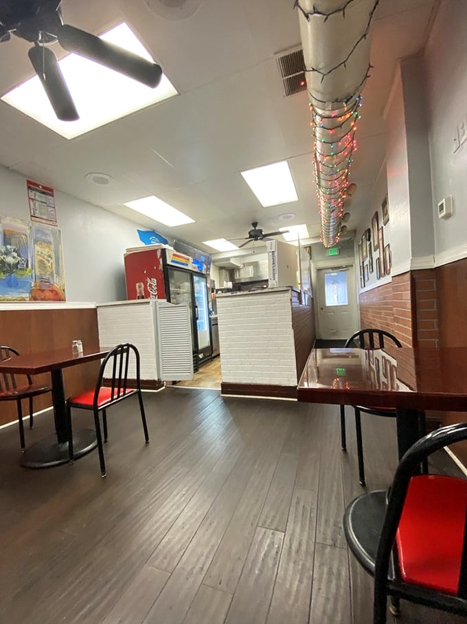 Simple decor, festive string lights, and those unmistakable red seat cushions&mdash;this no-frills dining room lets the food do all the talking.