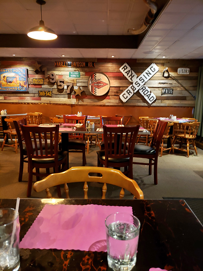 Rustic Americana adorns the walls – railroad signs and vintage memorabilia create the perfect backdrop for serious steak consumption.