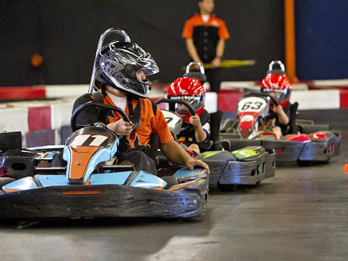 Helmeted warriors line up for battle, their focus laser-sharp as they prepare to outmaneuver opponents. The starting grid tension is deliciously palpable.