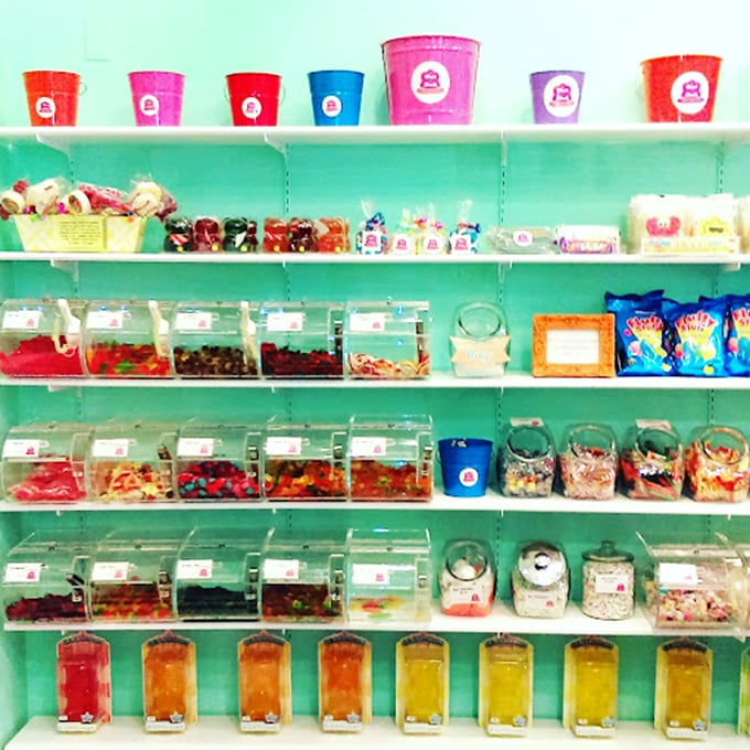 A rainbow of candy bins that would make Willy Wonka himself stop and take notes. The hardest decision you'll make today awaits behind that clear plastic.