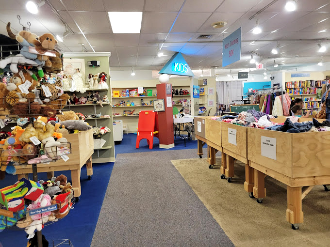 A plush paradise awaits in the kids' section, where stuffed animals of every species imaginable create a soft mountain of potential new friends. 