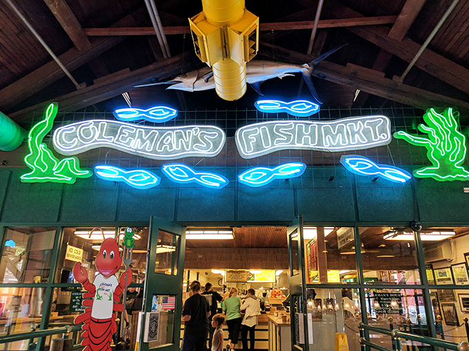 Coleman's Fish Market's neon sign glows like a beacon for hungry souls. That marlin overhead is practically winking at you!