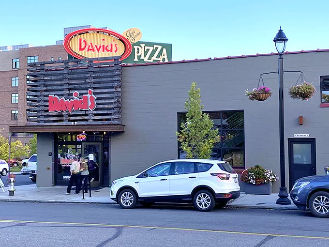 That neon glow says 'pizza sanctuary ahead.' David's stands like a lighthouse for the hungry souls of Spokane.