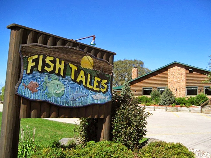 Fish Tales sign: A rustic log cabin housing ocean treasures? Only in Wisconsin! That playful wooden fish sign hints at the family-friendly vibe inside.