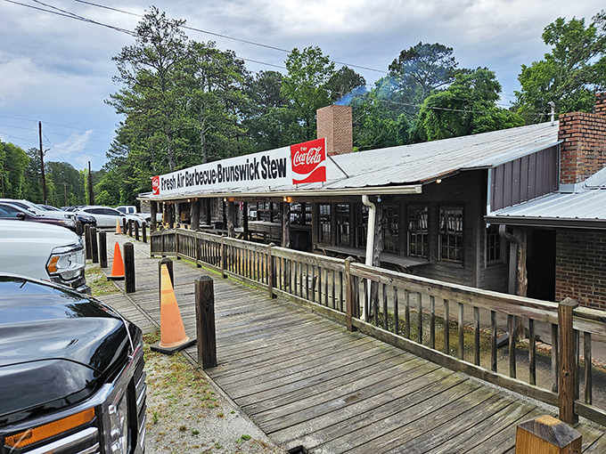 Where smoke signals meet Coca-Cola signs. Fresh Air BBQ's rustic wooden facade has been calling hungry travelers for generations.