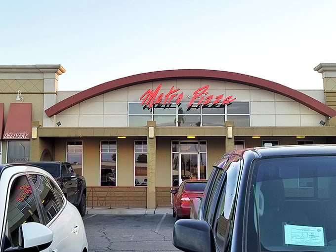 Metro Pizza: Vegas lights may dazzle, but this joint's real magic happens when dough meets sauce. Red walls and happy patrons tell the true story.