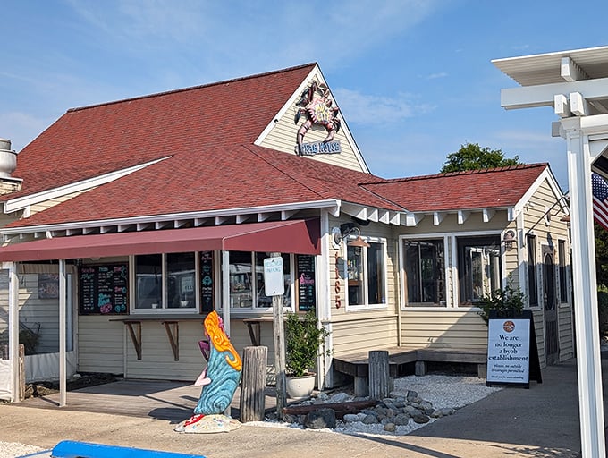 The mermaid statue welcomes you to seafood paradise! This red-roofed charmer may look humble, but locals know it delivers coastal gold.