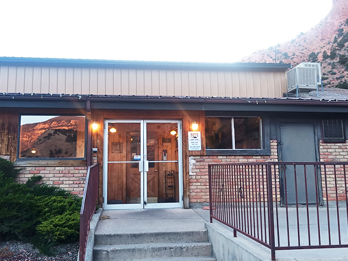 Mountain magic awaits! Rusty's Ranch House nestles against nature's backdrop, promising hearty meals after a day of adventure.