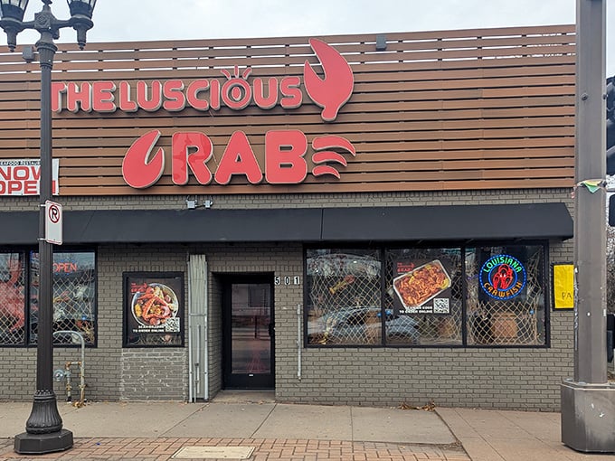 The Luscious Crab's sign glows like a beacon for seafood lovers. That giant red claw is basically saying, "Get in here, hungry people!"
