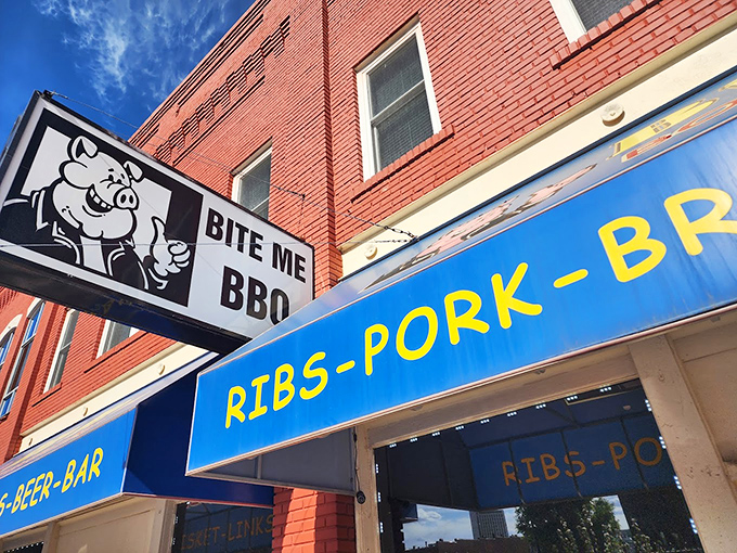 Bite Me BBQ: "That pig on the sign knows what you're in for. He's not winking, but if he could, he definitely would be."