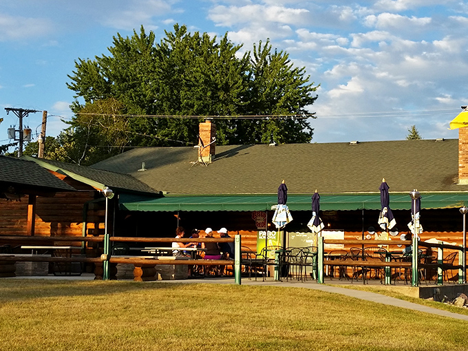 Fish Tales patio view: Where Paul Bunyan might stop for happy hour! Those umbrella tables practically beg you to linger over one more perch sandwich.