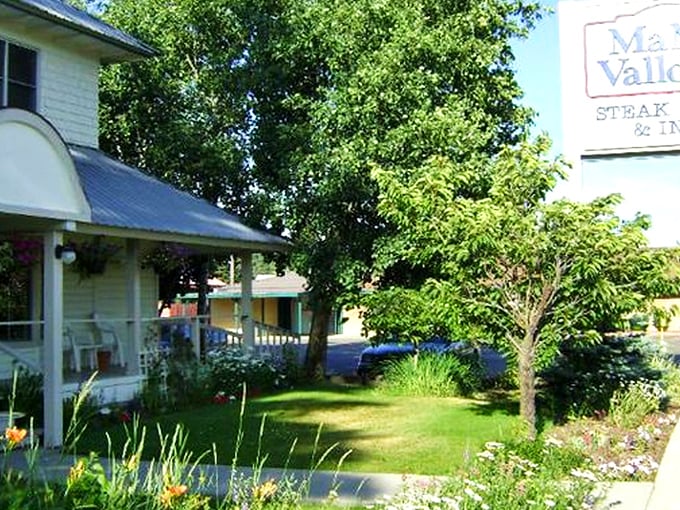 Garden-side dining at its finest, where flower beds meet bedtime stories about perfect ribeyes.