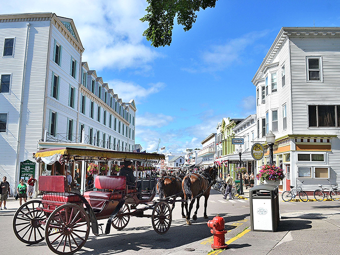 Mackinac Island's pristine white buildings line the harbor like a movie set. The only traffic jam here involves horses and sweet fudge aromas.