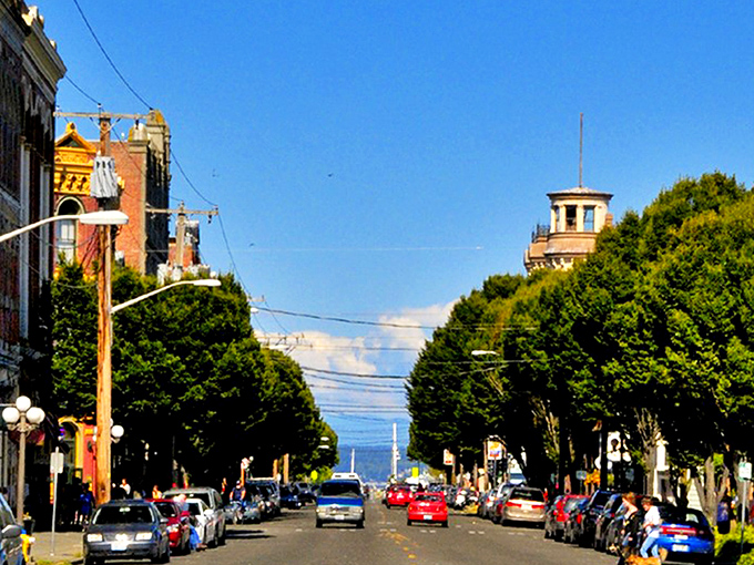 The lighthouse watches over Port Townsend like a faithful sentinel, painting a perfect silhouette against the golden sunset sky.
