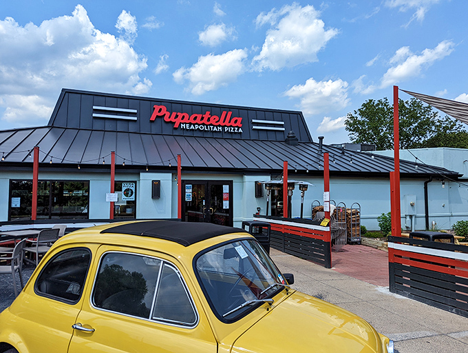 That yellow Fiat isn't just decoration; it's a promise that what awaits inside is authentically Italian, no passport required.