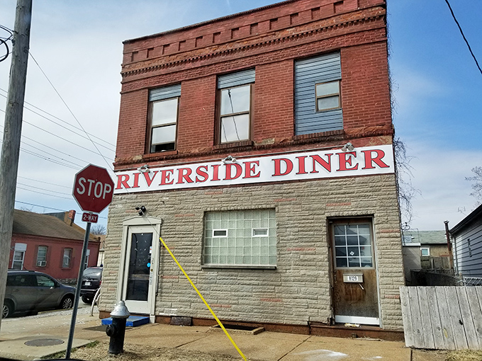 Who needs fancy when you've got authentic? Riverside Diner stands proudly at this corner like it's guarding a sacred breakfast tradition.