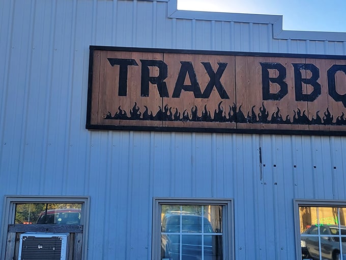 That wooden sign with flames says everything you need to know: fire meets meat meets happiness inside this unassuming building.