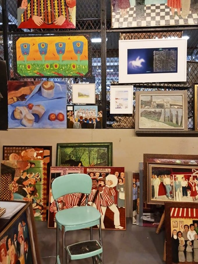 A gallery wall where art isn't just hung&mdash;it's curated into conversations across time periods, with that turquoise chair stealing the spotlight.