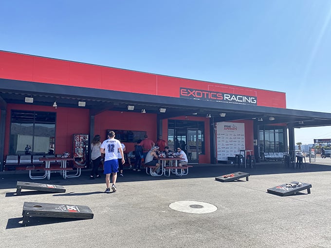 The red-trimmed Exotics Racing facility&mdash;where ordinary humans transform into racing legends between breakfast and lunch.