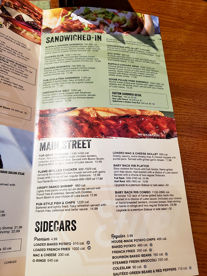 The menu reads like a road map to satisfaction, with "Main Street" and "Sidecars" guiding hungry travelers to their next culinary destination.