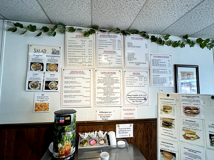 The wall menu tells a delicious story of American classics meeting Mediterranean magic, no translation dictionary required.