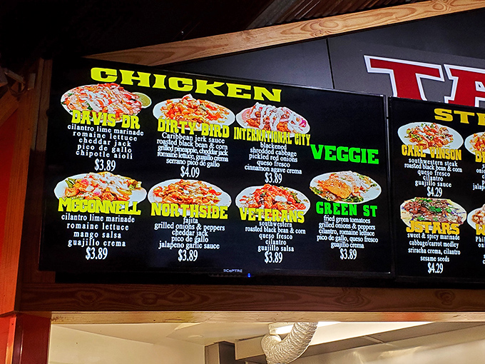 The illuminated menu board&mdash;a beacon of hope for the hungry. Each colorfully named taco promises a different journey for your taste buds.