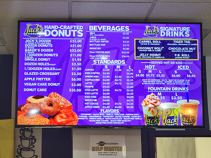 The menu board—a purple portal to paradise listing everything from classic glazed to the legendary apple fritter. Choose wisely, or just get one of each.