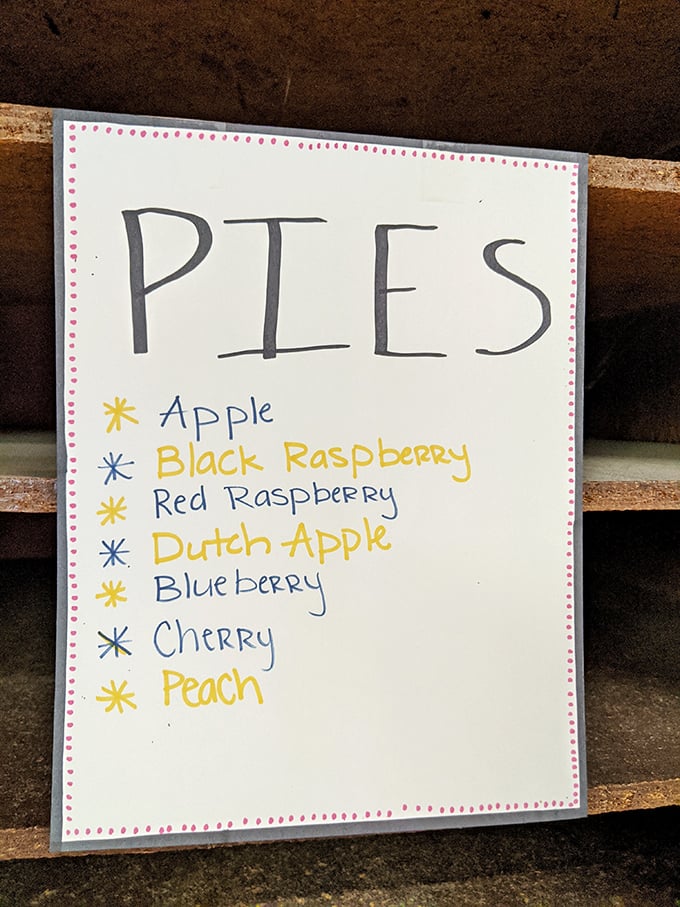 This handwritten pie menu isn't just a list; it's a roadmap to happiness with seven delectable destinations.