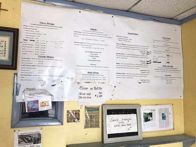 The well-worn menu board tells a story of culinary focus rather than endless options. In the gyro game, specialists beat generalists every time.