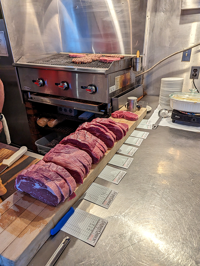 Meat masterpieces awaiting their moment of glory. Each steak ticket represents someone's imminent happiness.