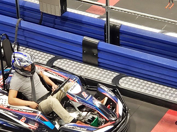 The moment of truth: adjusting to your chariot before unleashing inner speed demons. That helmet isn't just for show, folks.