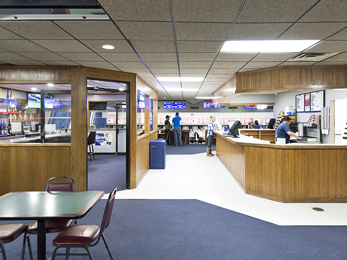 Behind these wood-paneled counters, bowling's unsung heroes dispense shoes, advice, and occasional lane maintenance wisdom with equal parts efficiency and charm.