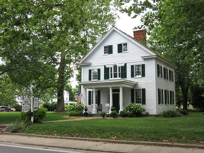 The Calvin B. Taylor House stands as a pristine example of 19th-century architecture, its white clapboard exterior and green shutters whispering stories of bygone days.