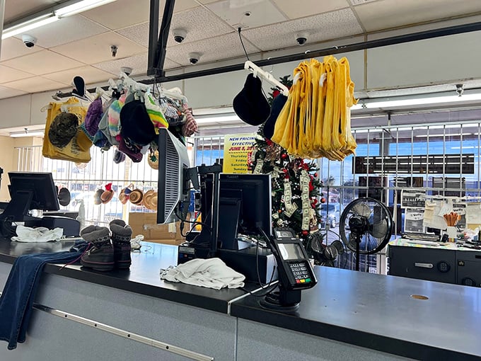 Yellow tags hanging like ripe fruit above the checkout counter remind shoppers of the daily pricing ritual.
