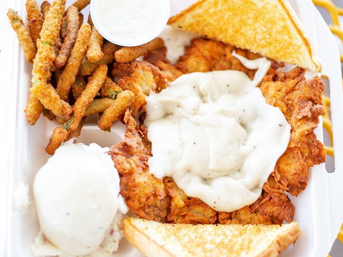 This isn't just chicken fried steak&mdash;it's edible architecture, where golden-crusted beef and creamy gravy create the foundation of comfort food paradise.