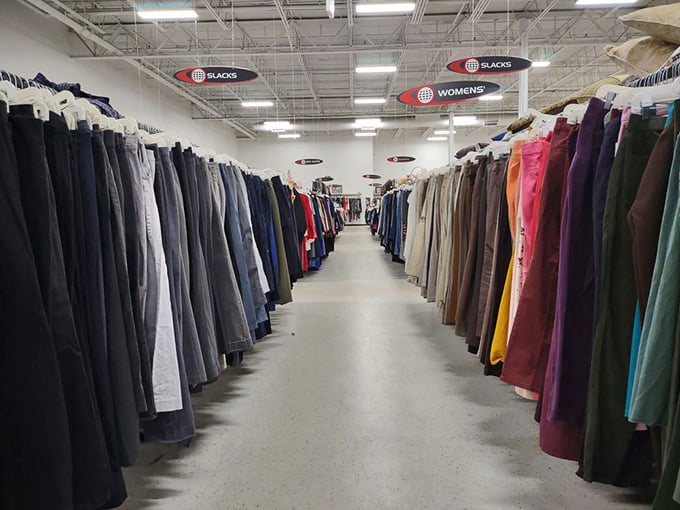 The pants section stretches into infinity like a denim galaxy, each pair with its own story and previous life waiting to be continued.