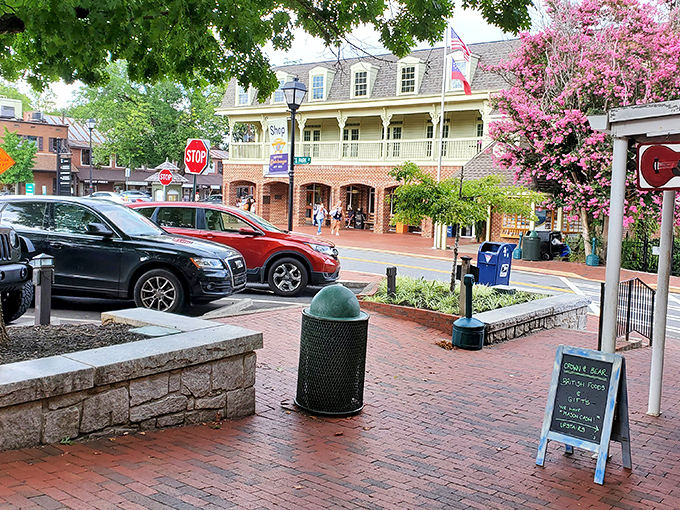 Spring brings Dahlonega's streets to life with blooming trees and visitors strolling brick sidewalks, creating a scene that belongs on a small-town tourism brochure.