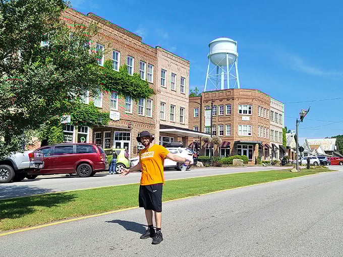 That iconic water tower watches over Main Street like a proud parent. Brick buildings and blue skies create a postcard-perfect scene straight from a movie set.
